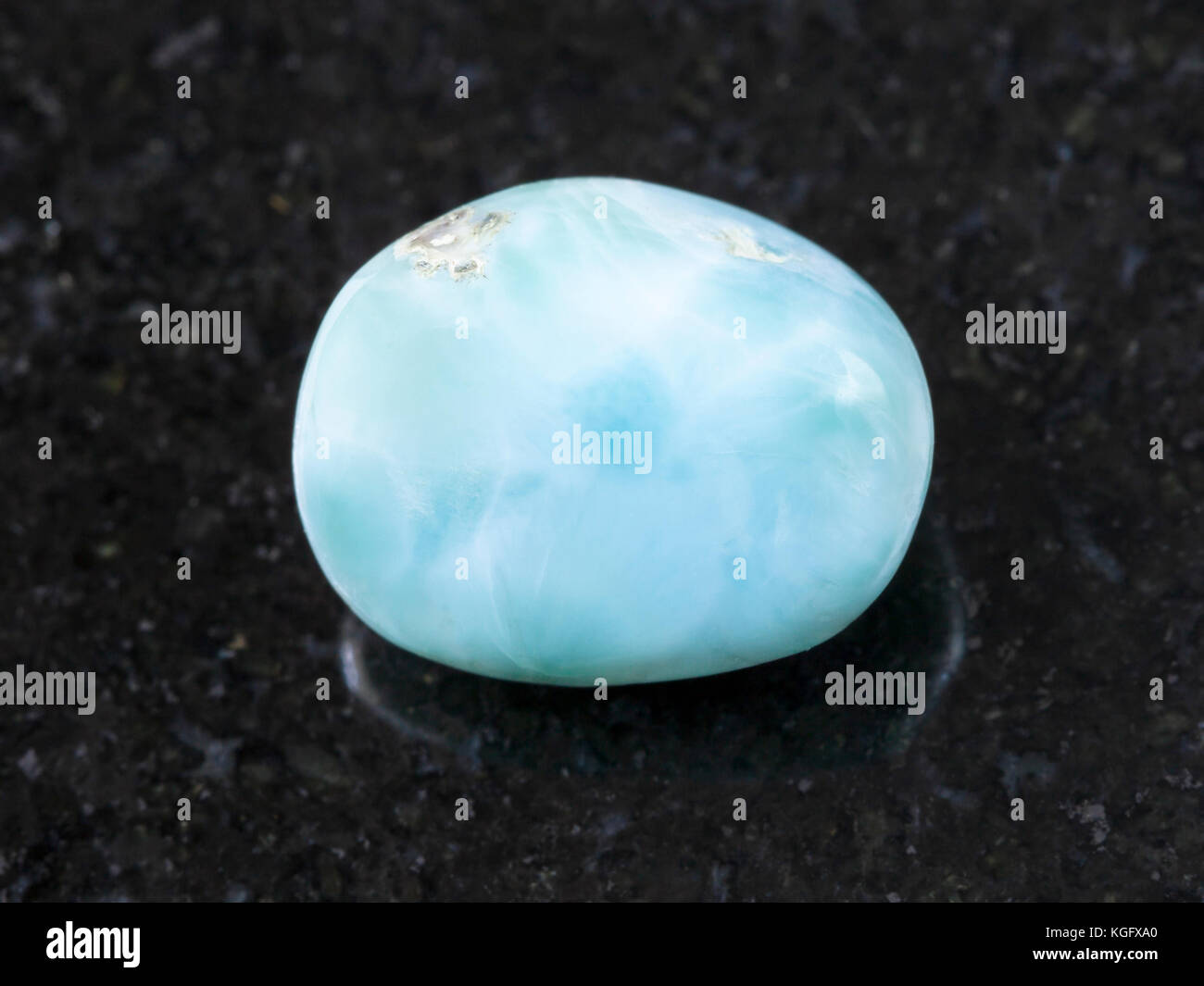 macro shooting of natural mineral rock specimen - tumbled Larimar ...