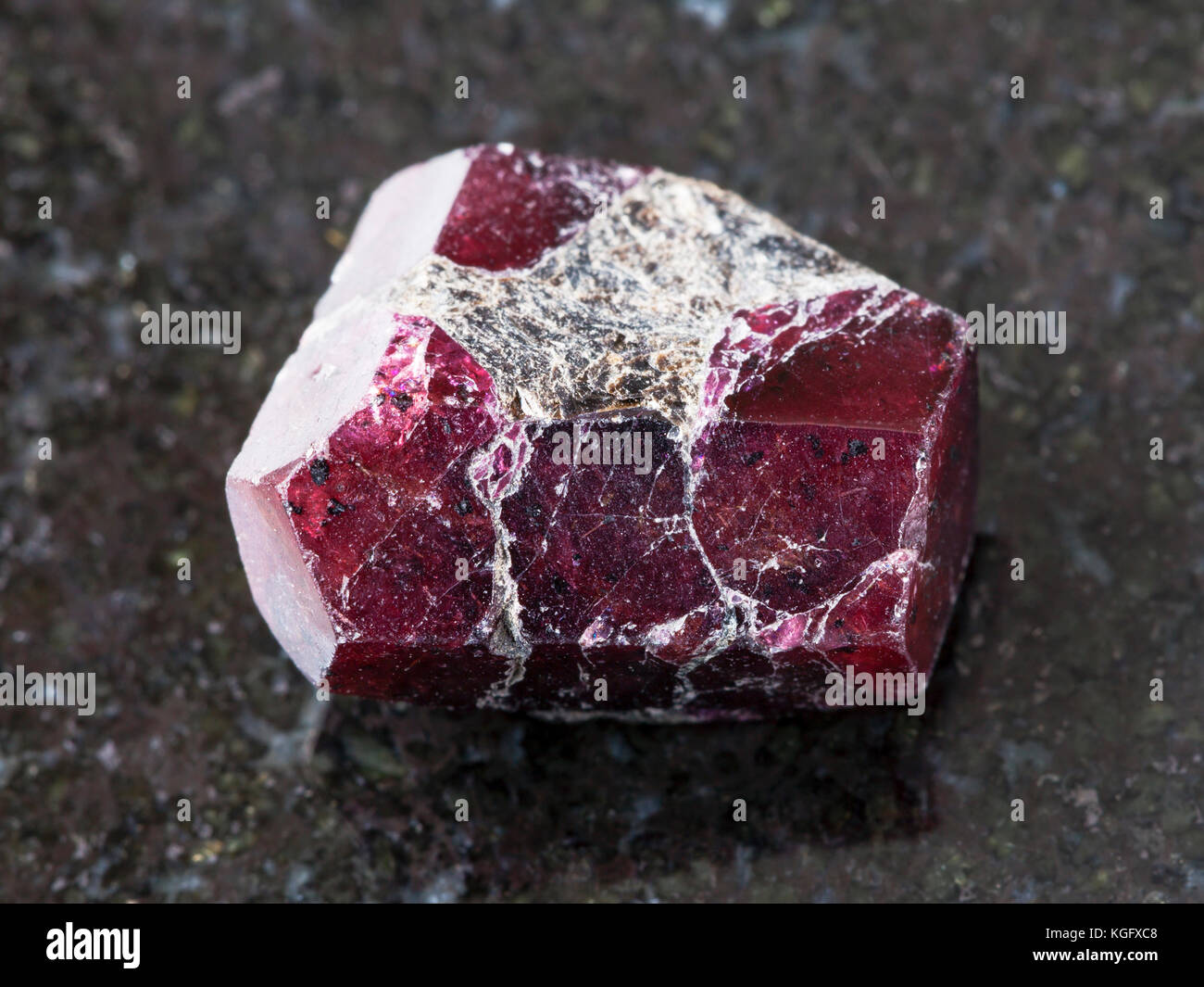 macro shooting of natural mineral rock specimen - rough crystal of red ...