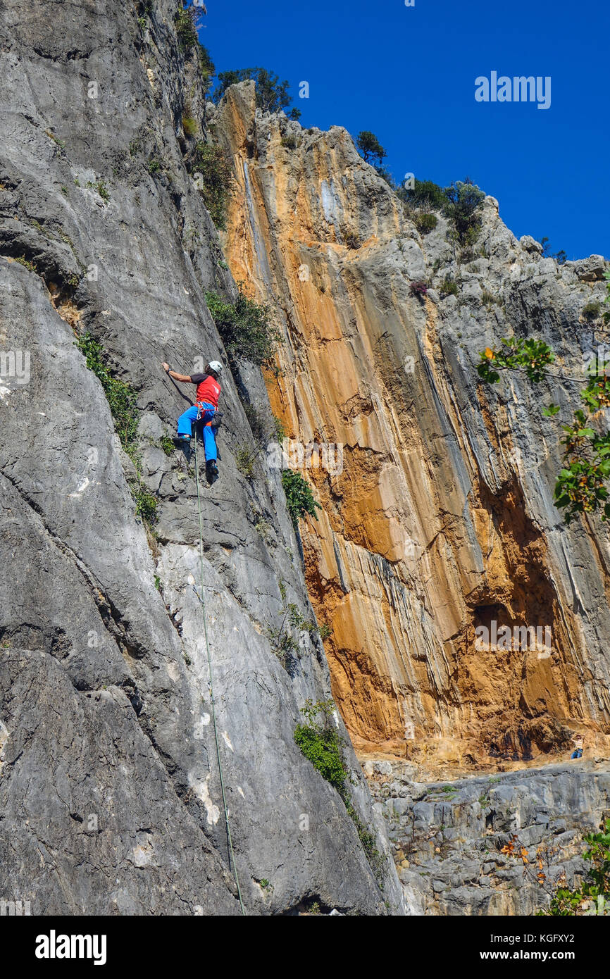 Solitary rock climber on steep rock face, cliff Stock Photo - Alamy