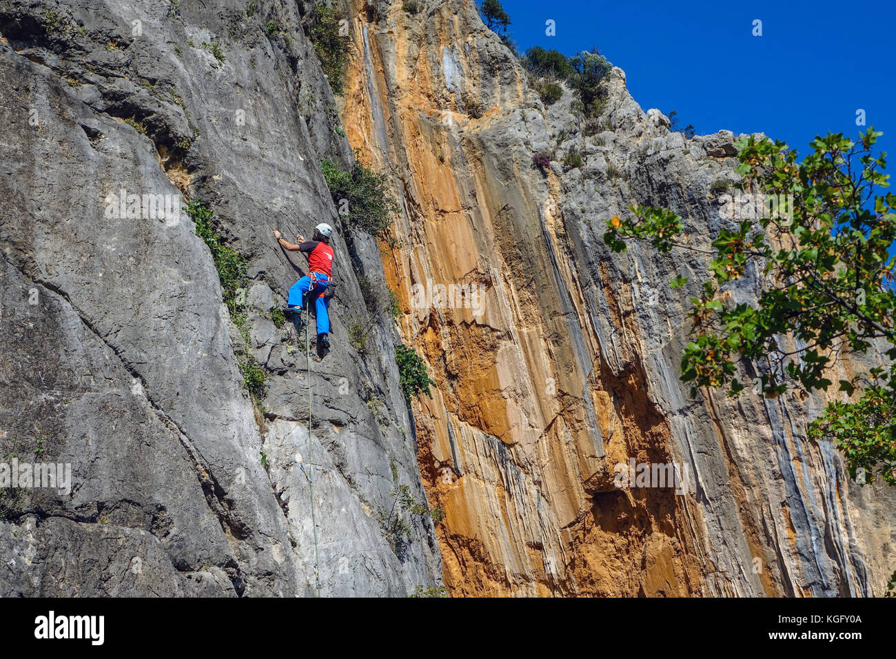 Solitary rock climber on steep rock face, cliff Stock Photo - Alamy