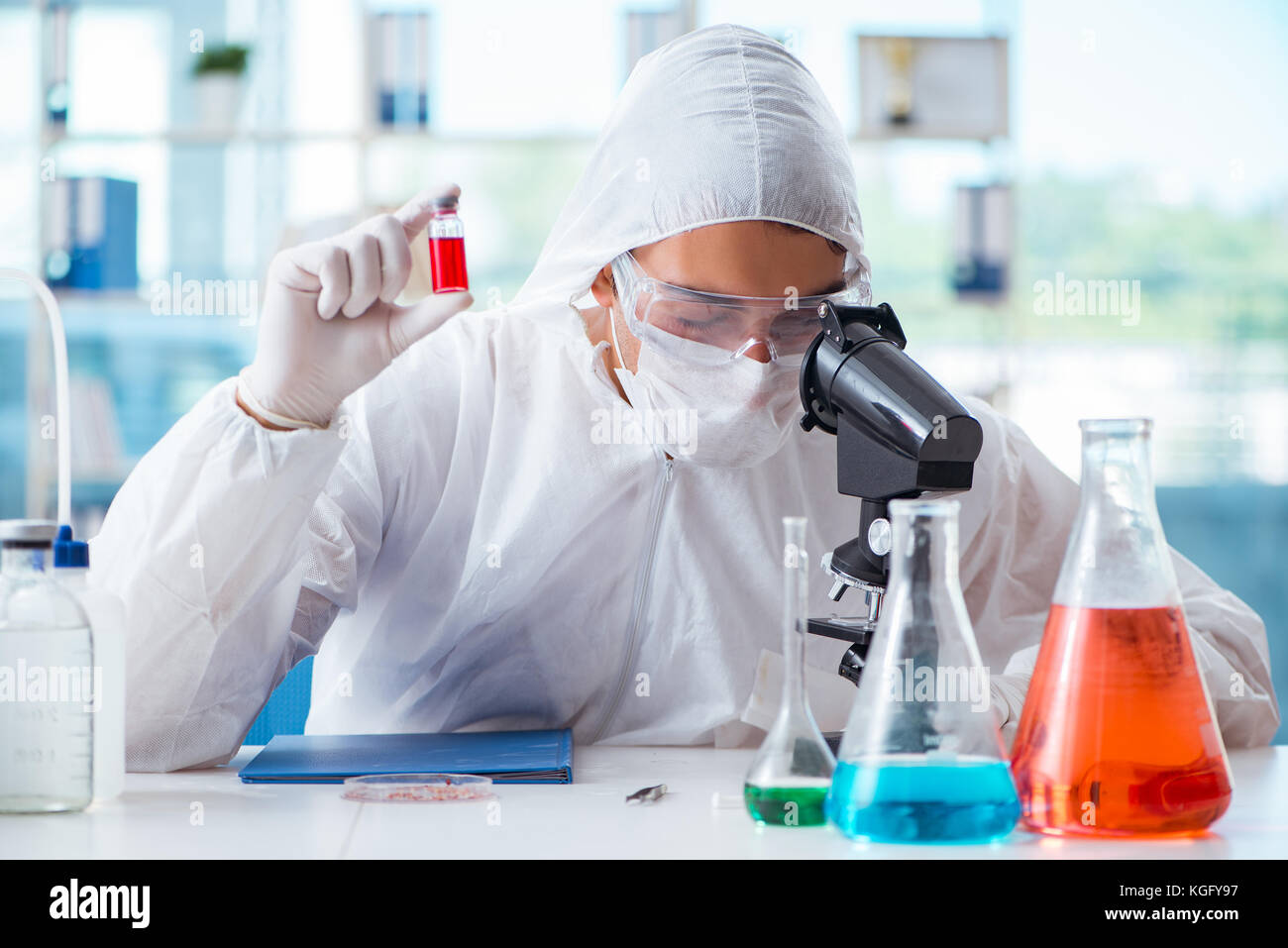 Chemist working in the laboratory with hazardous chemicals Stock Photo ...