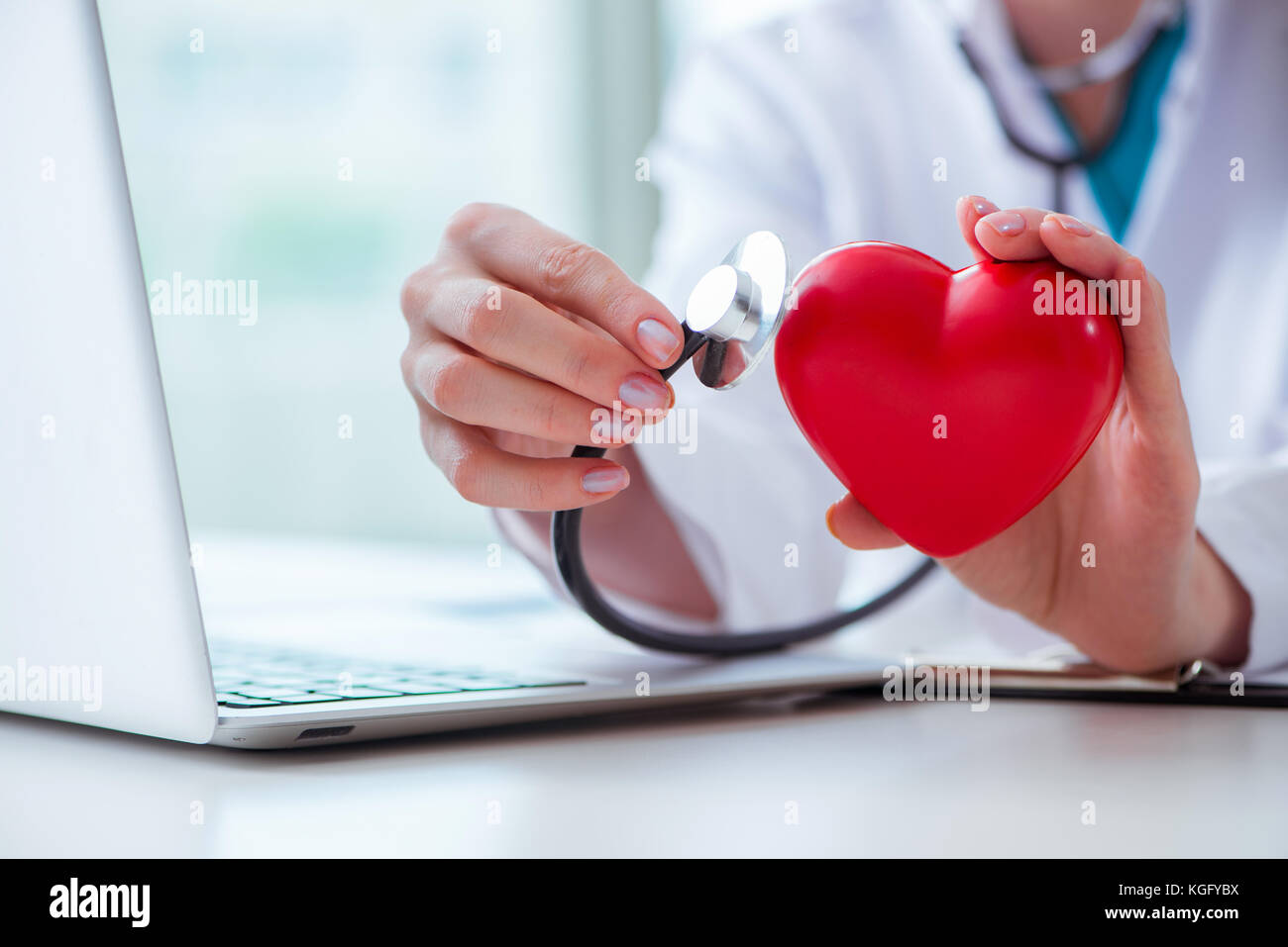 Doctor checking up heart in medical concept Stock Photo - Alamy