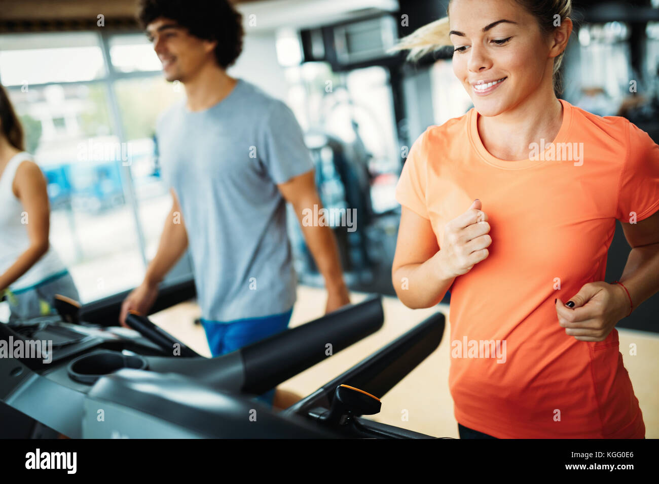 Young attractive woman doing cardio training in gym Stock Photo - Alamy