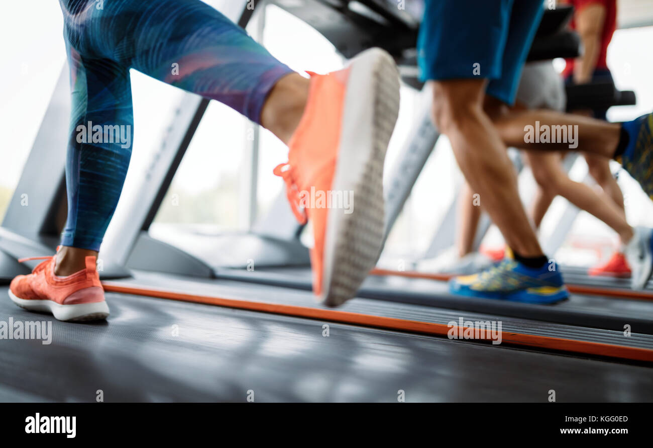 Picture of people running on treadmill in gym Stock Photo - Alamy