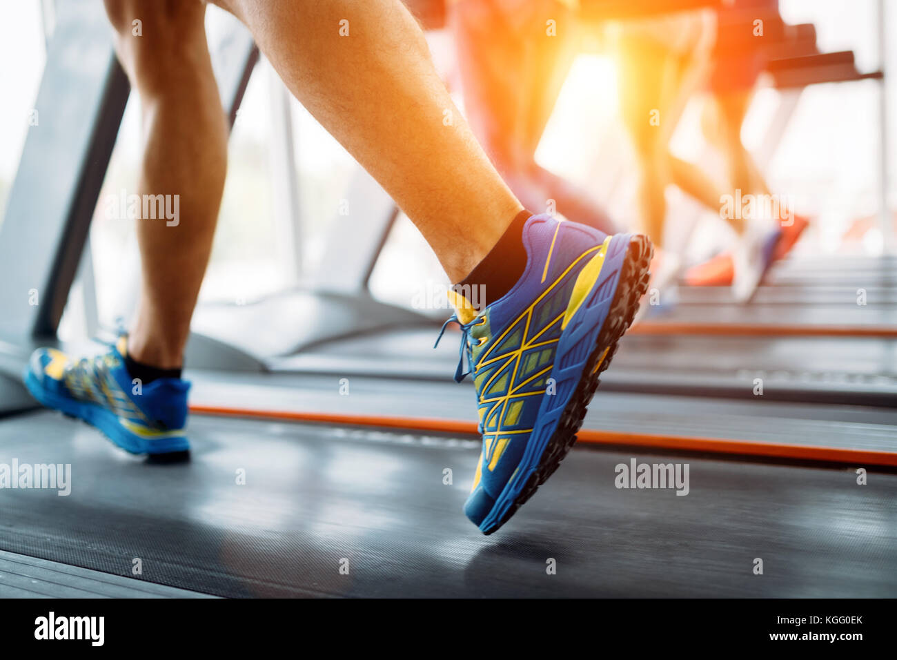 Picture of people running on treadmill in gym Stock Photo - Alamy
