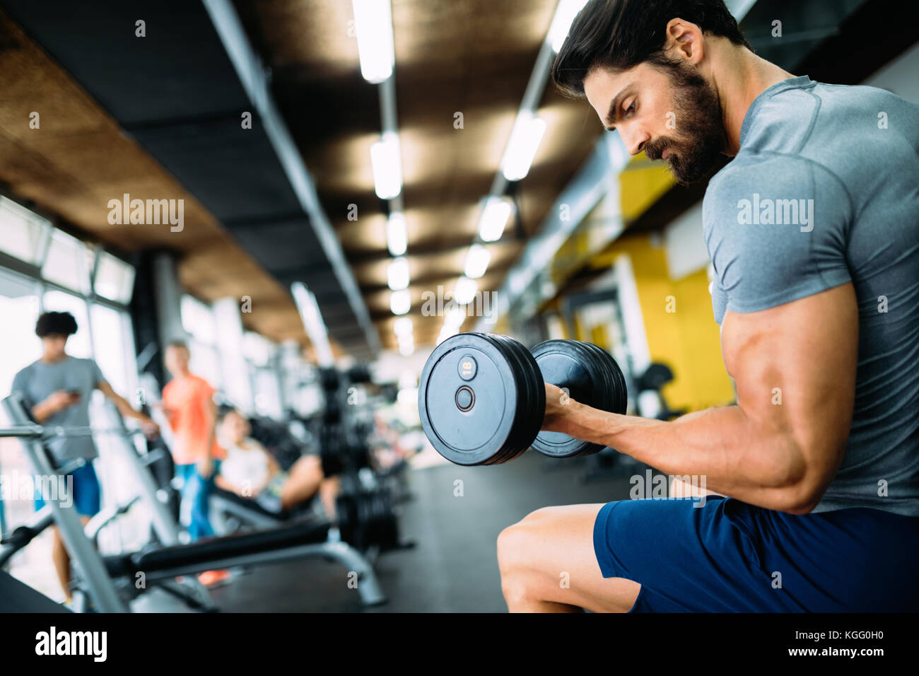Man in gym exercises arms hi-res stock photography and images - Alamy