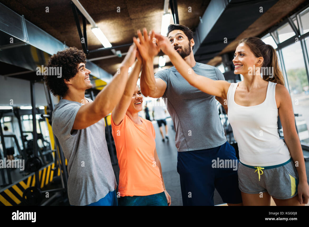 Portrait of cheerful fitness team in gym Stock Photo - Alamy