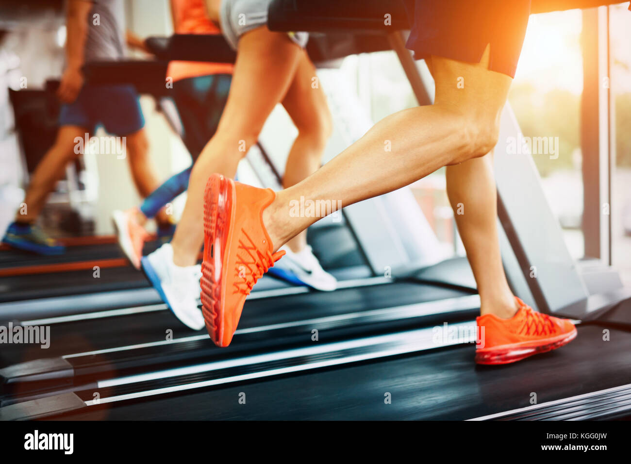 Picture of people running on treadmill in gym Stock Photo - Alamy