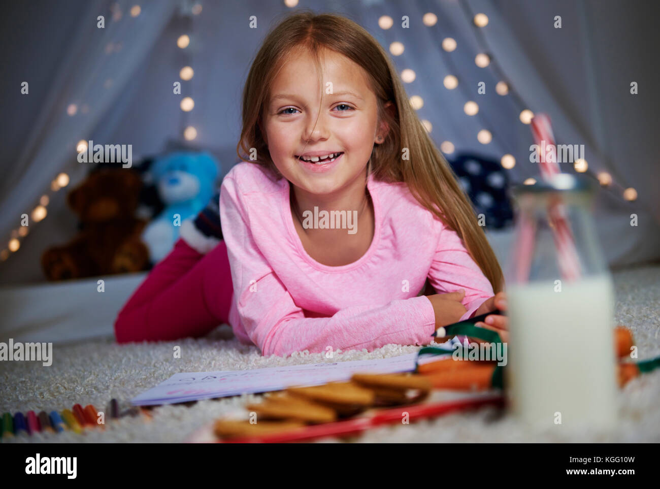 Cheerful girl posing while drawing Stock Photo - Alamy