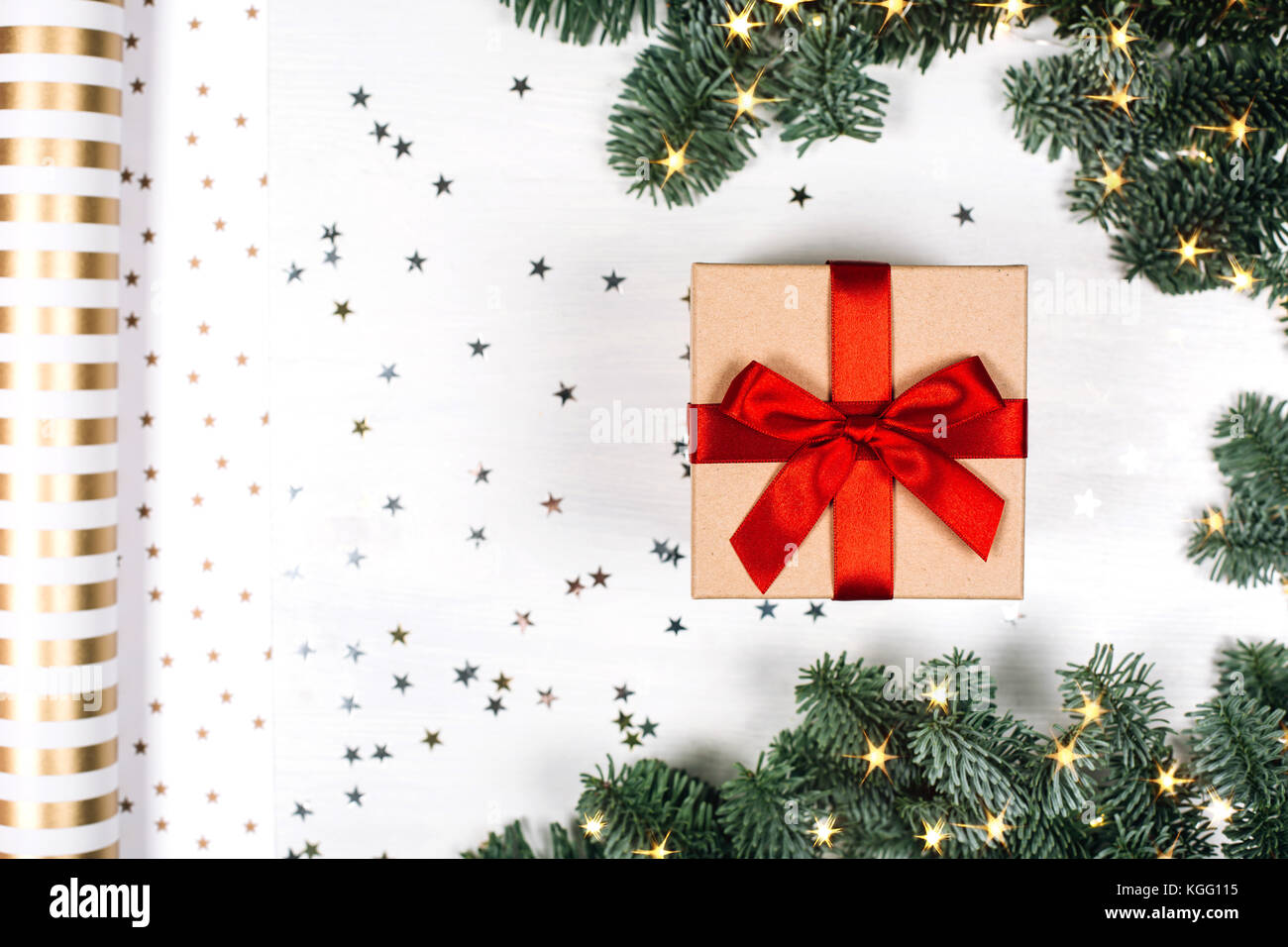 Christmas gift with red bow Stock Photo - Alamy