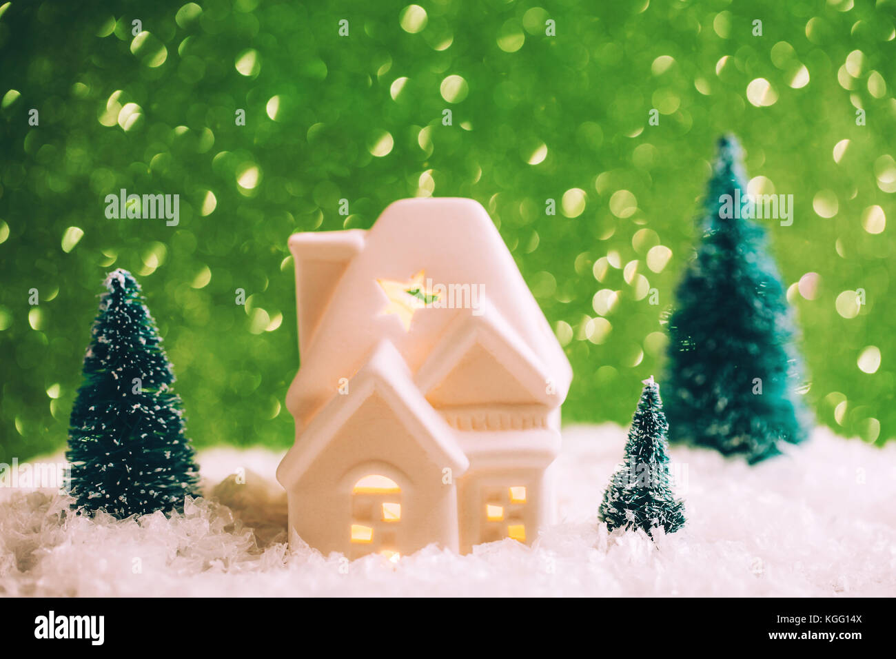 Little toy house with three pines Stock Photo - Alamy