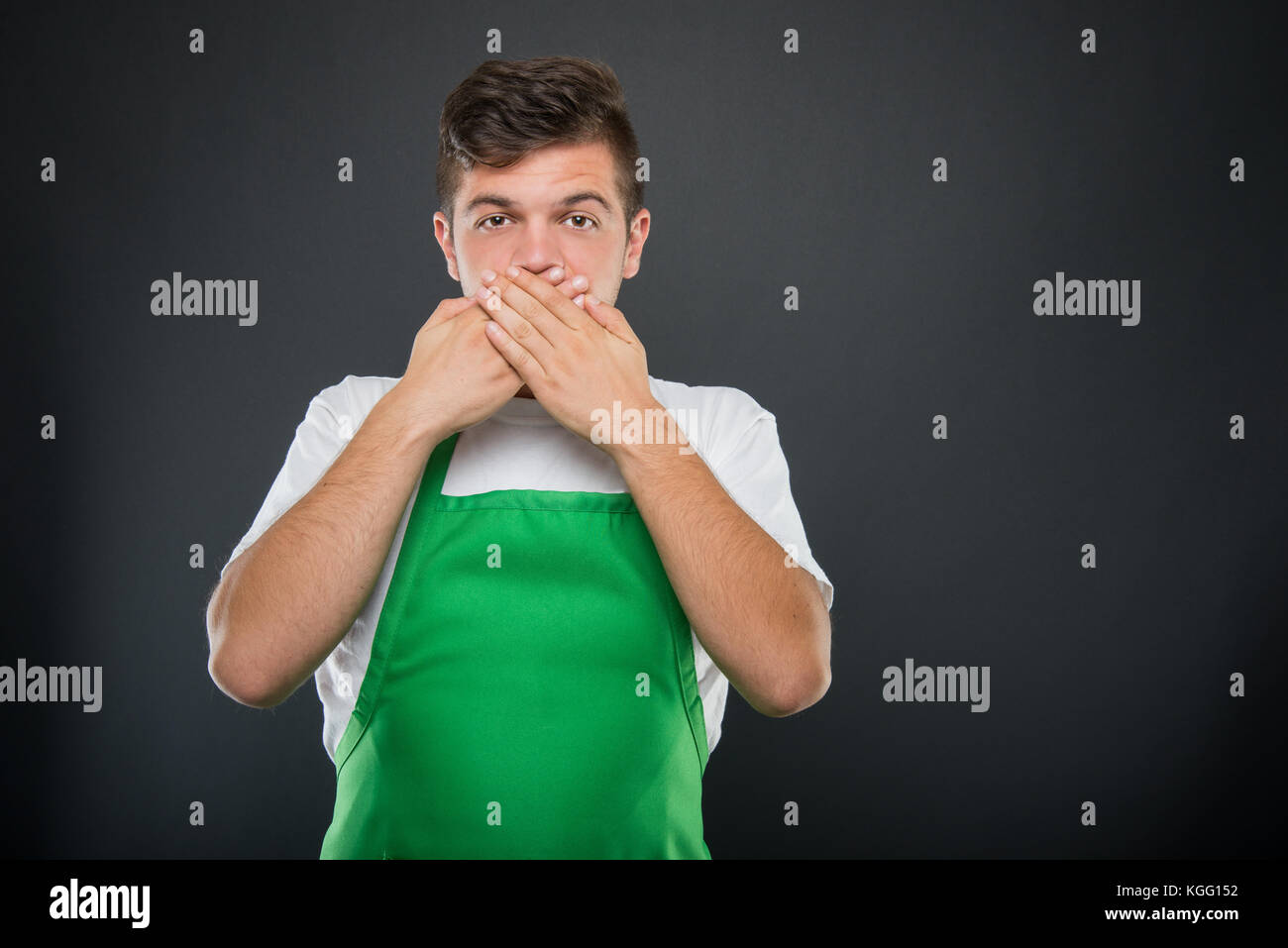 Portrait of supermarket employer gesturing mute monkey concept on black ...