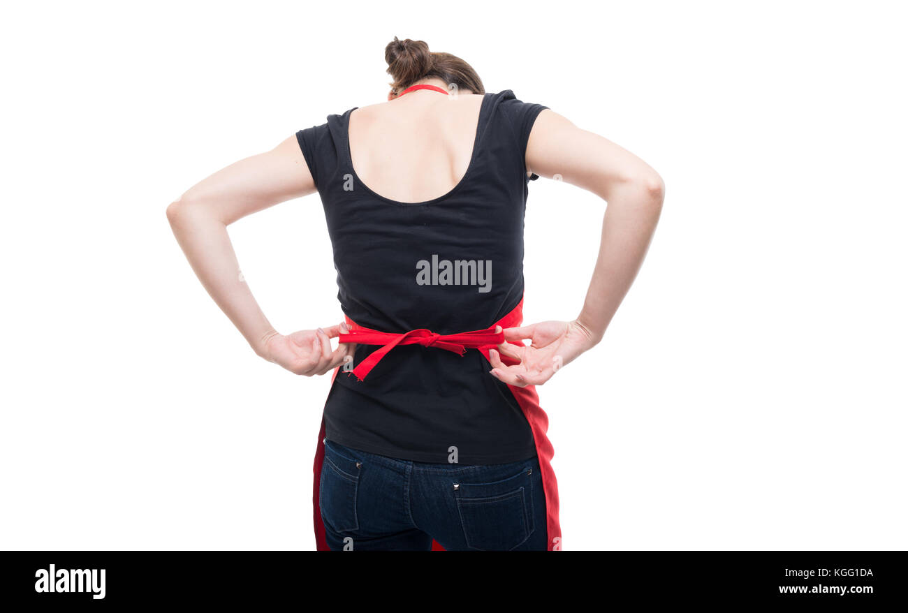 Back view of seller hands tying her apron getting ready for work Stock ...