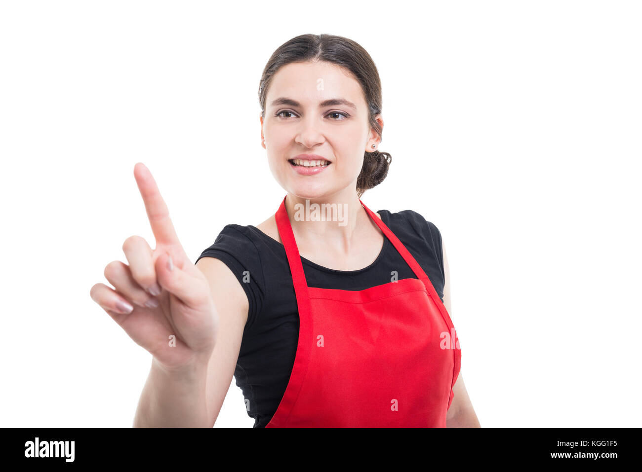 Smiling woman touching the screen with her finger isolated on a white ...