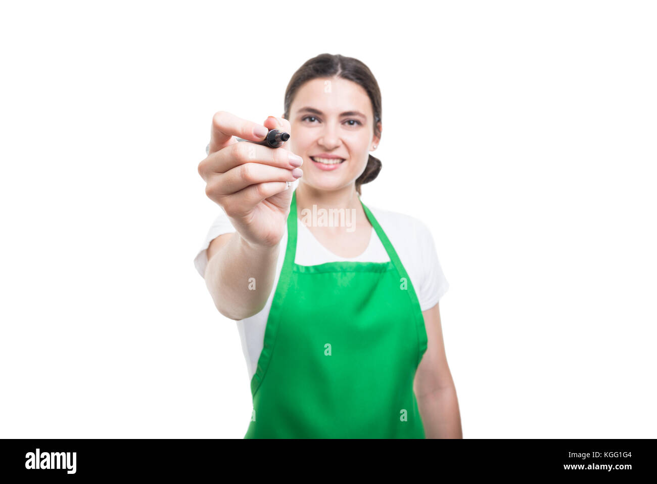 Happy female clerk writing with marker on transparent blank screen ...