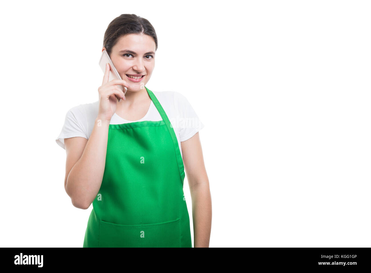 Successful female clerk making a call on her cellphone on white ...