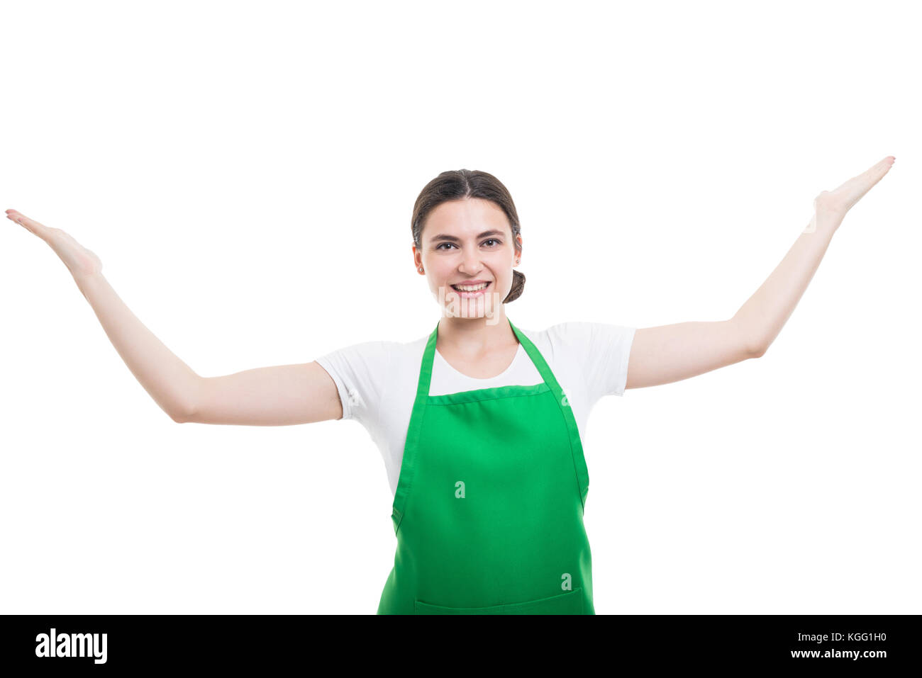 Cheerful girl employer holding arms up or presenting something with ...