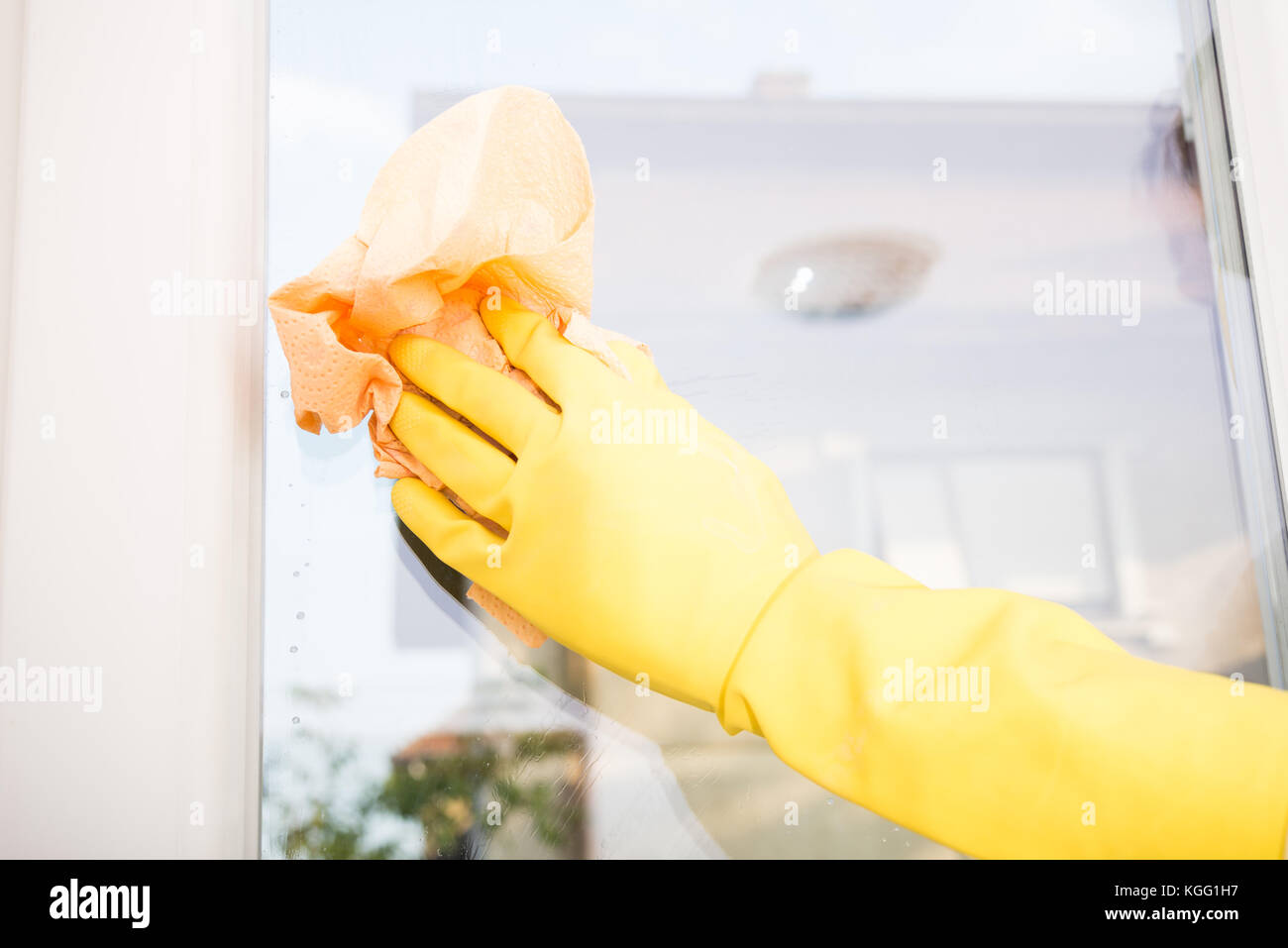 Closeup of woman with gloves cleaning the window with rag at home Stock ...