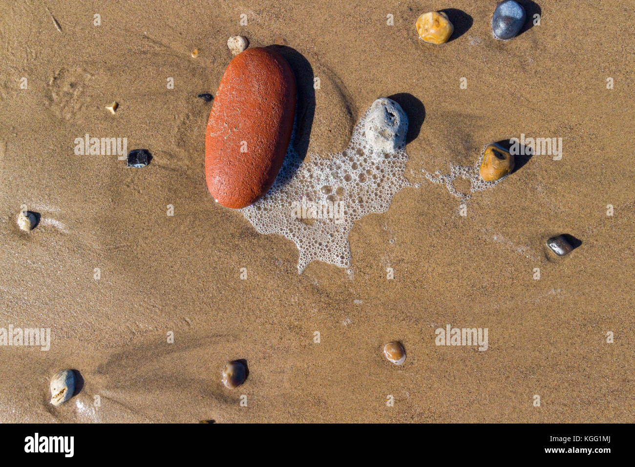 Pebbles and stones make attractive patterns in the sand on Seaham Beach ...