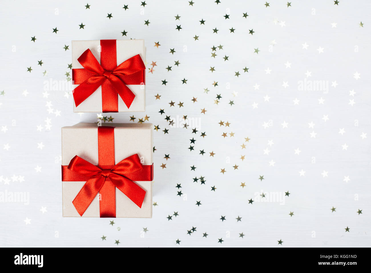 Two presents with red bow Stock Photo - Alamy