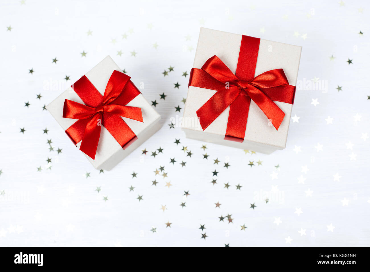 Two presents with red bow Stock Photo - Alamy