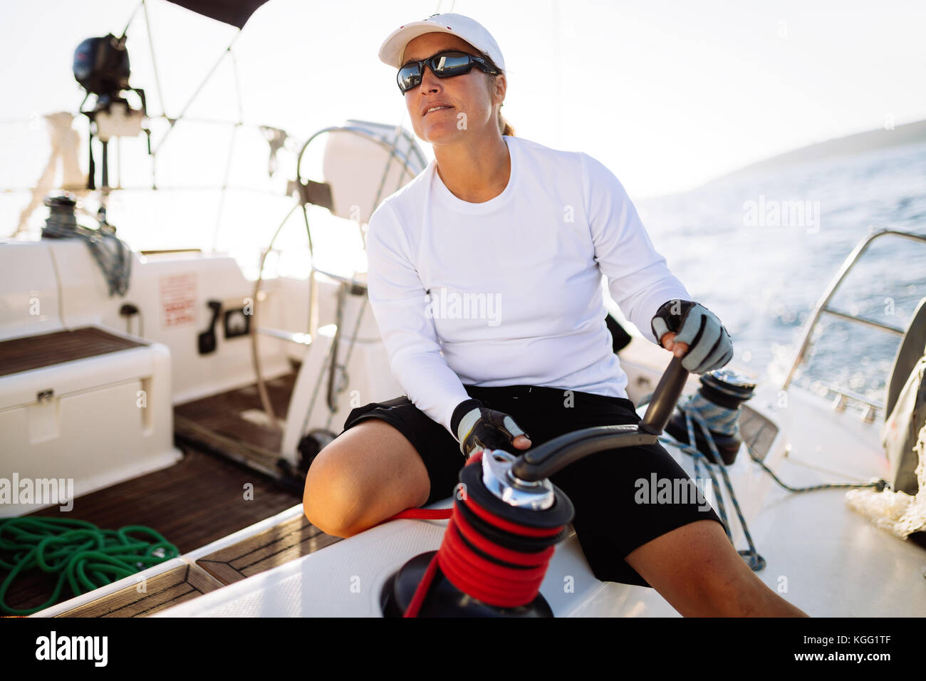 Attractive strong woman sailing with her boat Stock Photo - Alamy