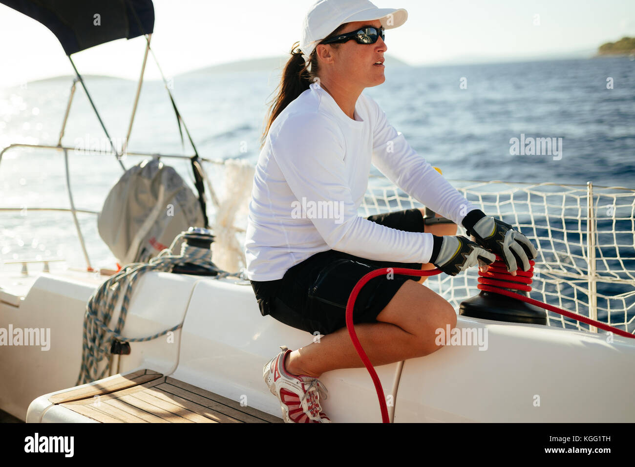 Attractive strong woman sailing with her boat Stock Photo - Alamy