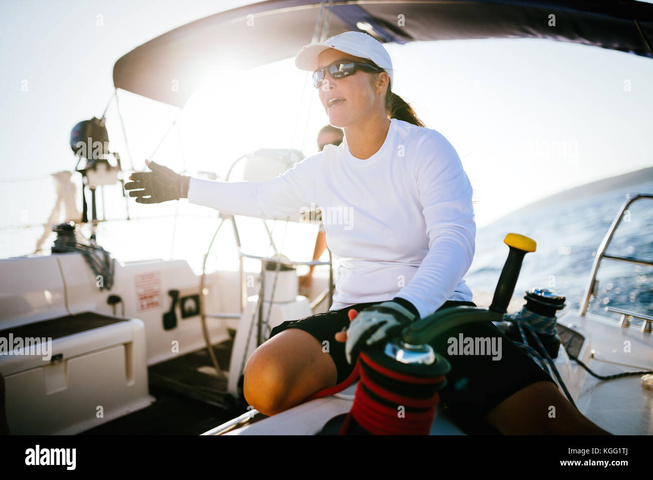 Attractive strong woman sailing with her boat Stock Photo - Alamy
