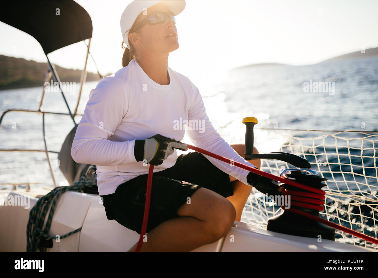 Attractive strong woman sailing with her boat Stock Photo - Alamy