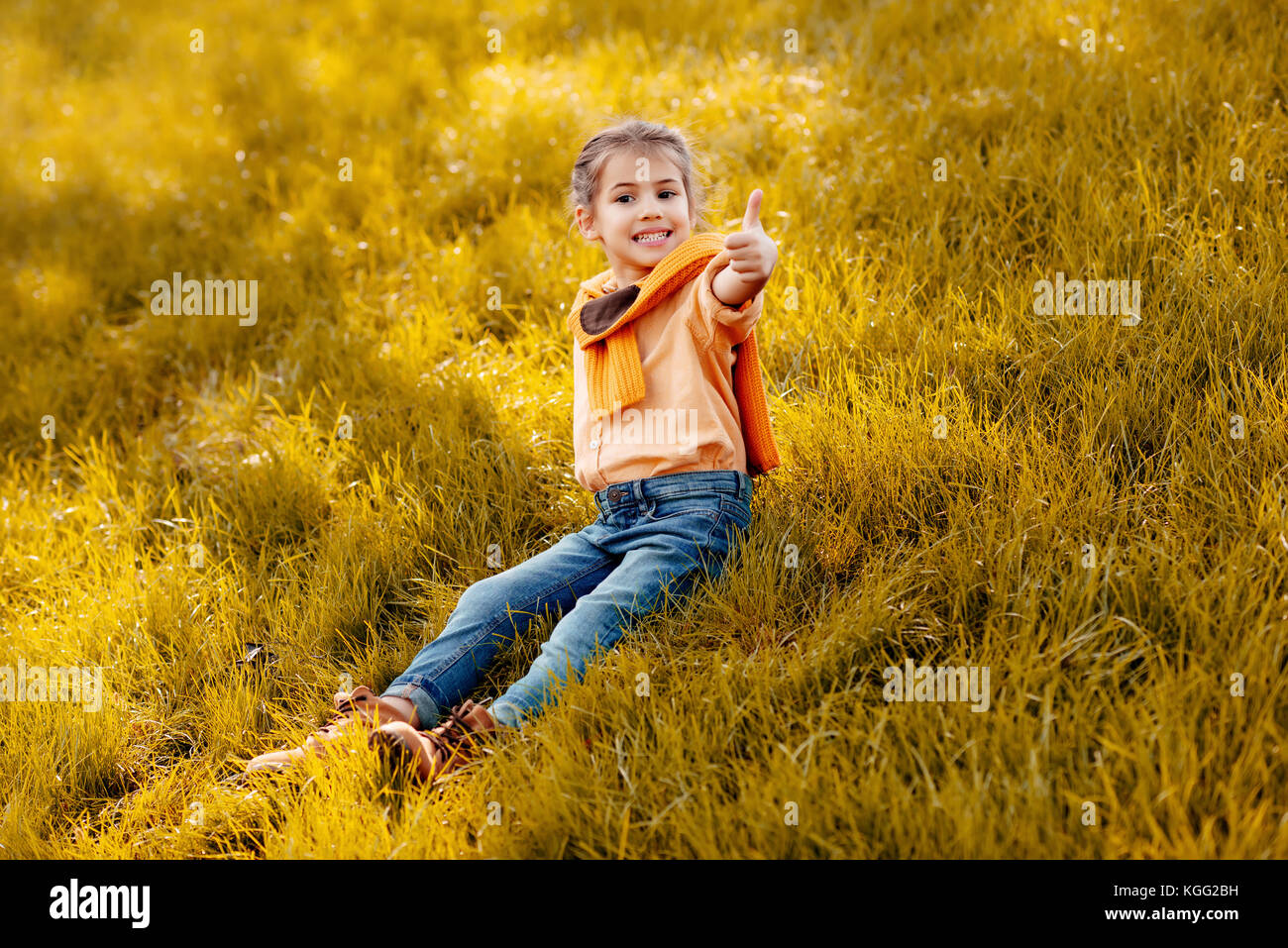 child showing thumb up Stock Photo - Alamy
