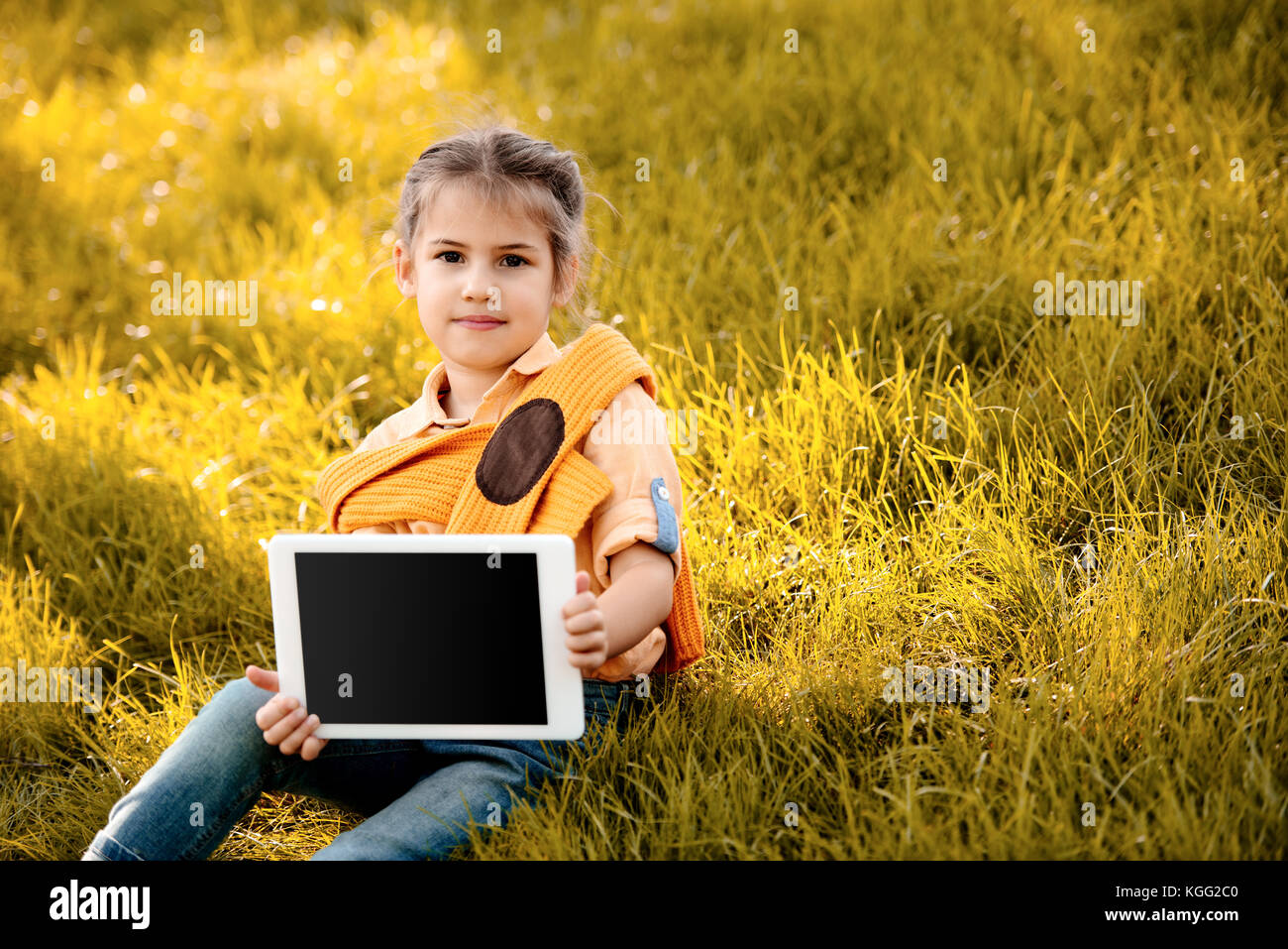 child showing digital tablet Stock Photo - Alamy