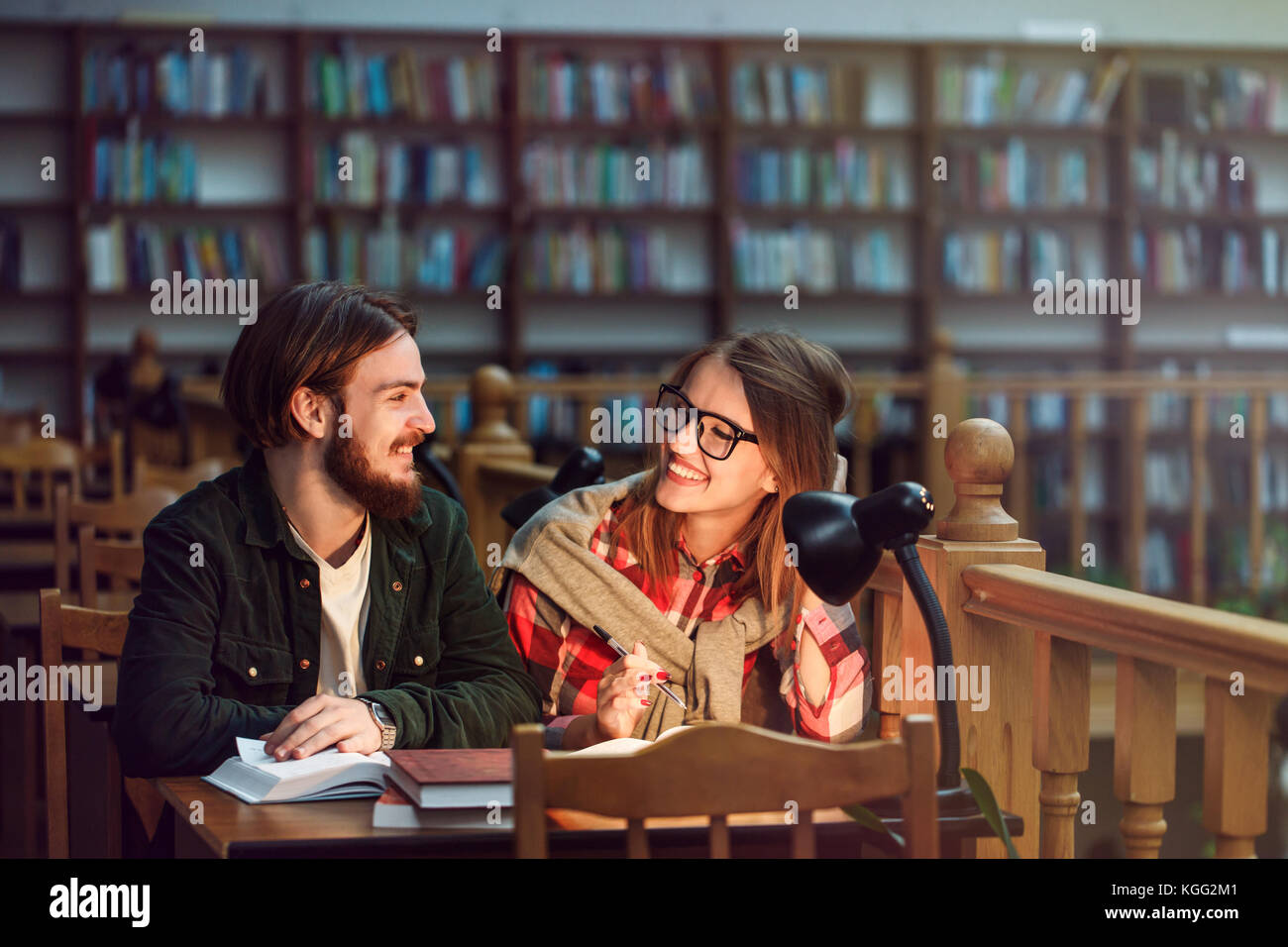 Portrait of Couple of Students in Library Stock Photo - Alamy