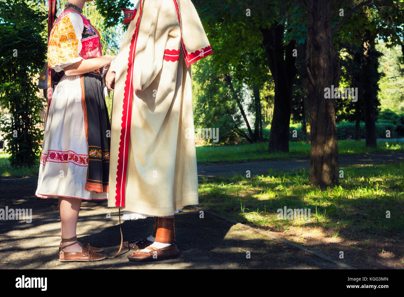 Young anonymous couple in folklore costumes Stock Photo - Alamy