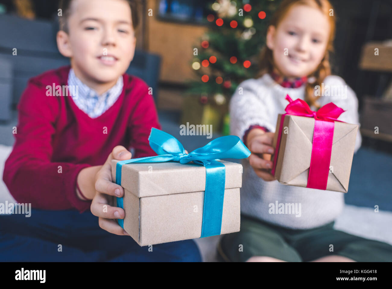 kids holding gift boxes Stock Photo - Alamy