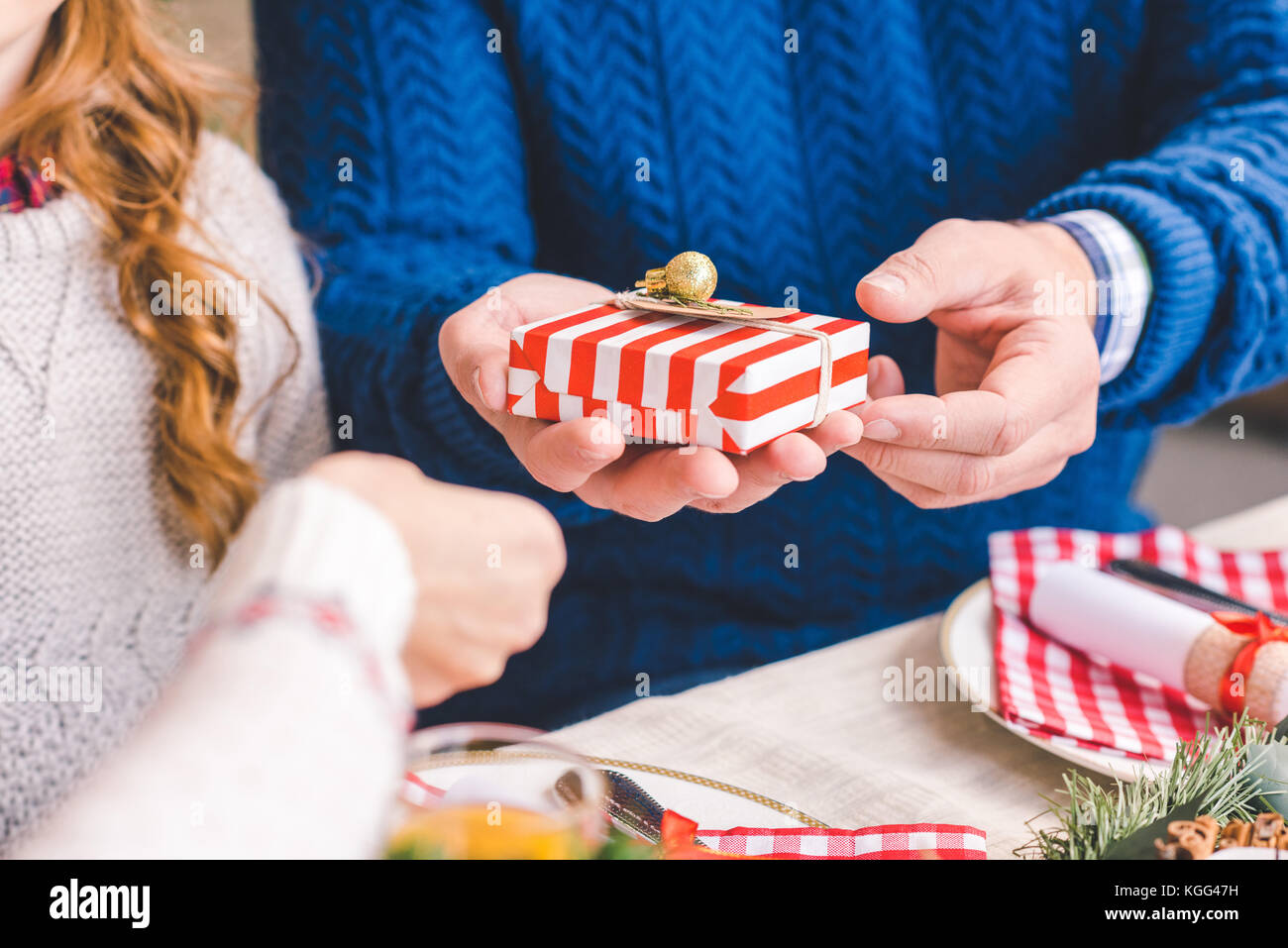 man giving gift box to woman Stock Photo - Alamy