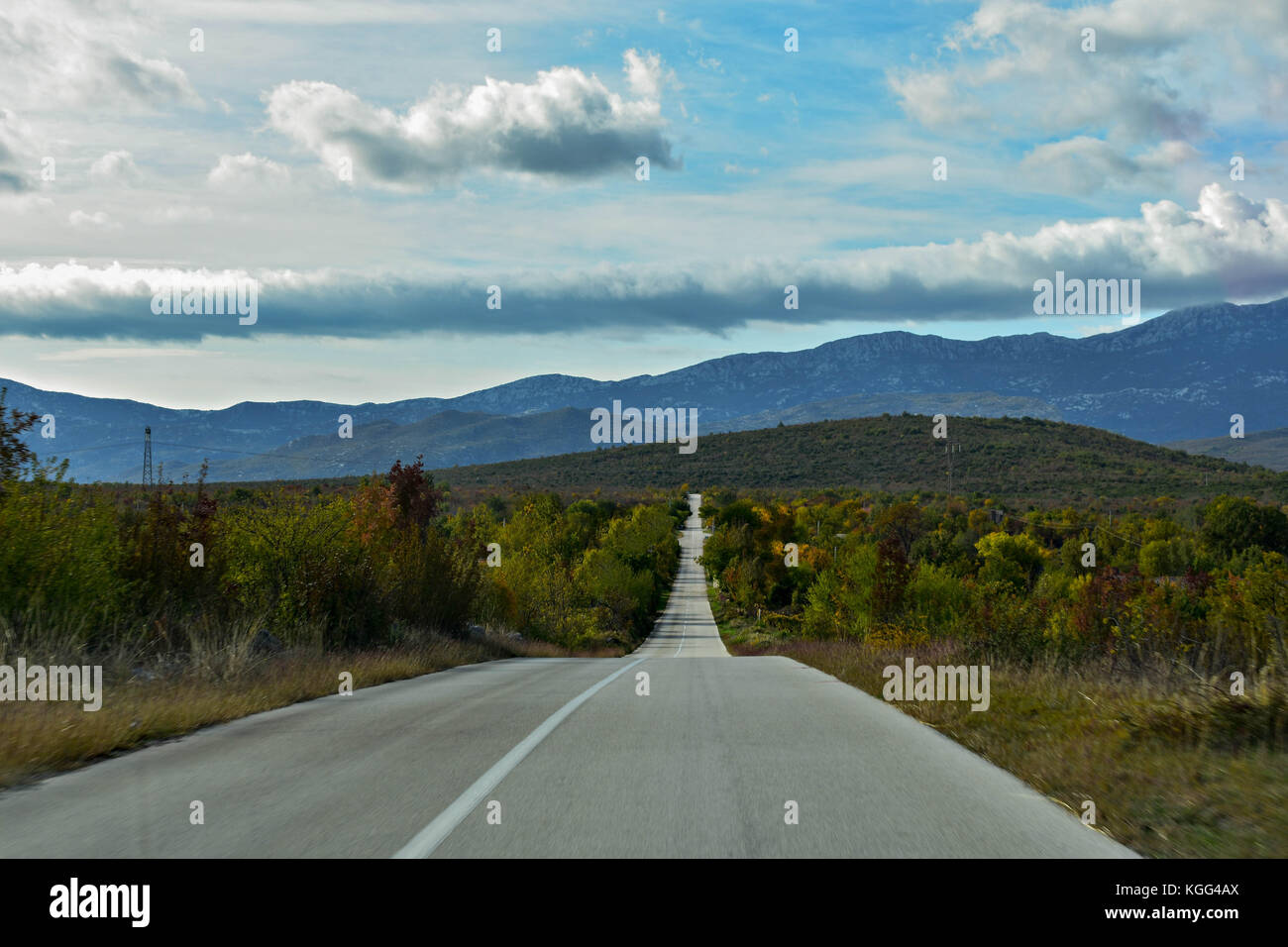Long open road through beautiful countryside Stock Photo - Alamy