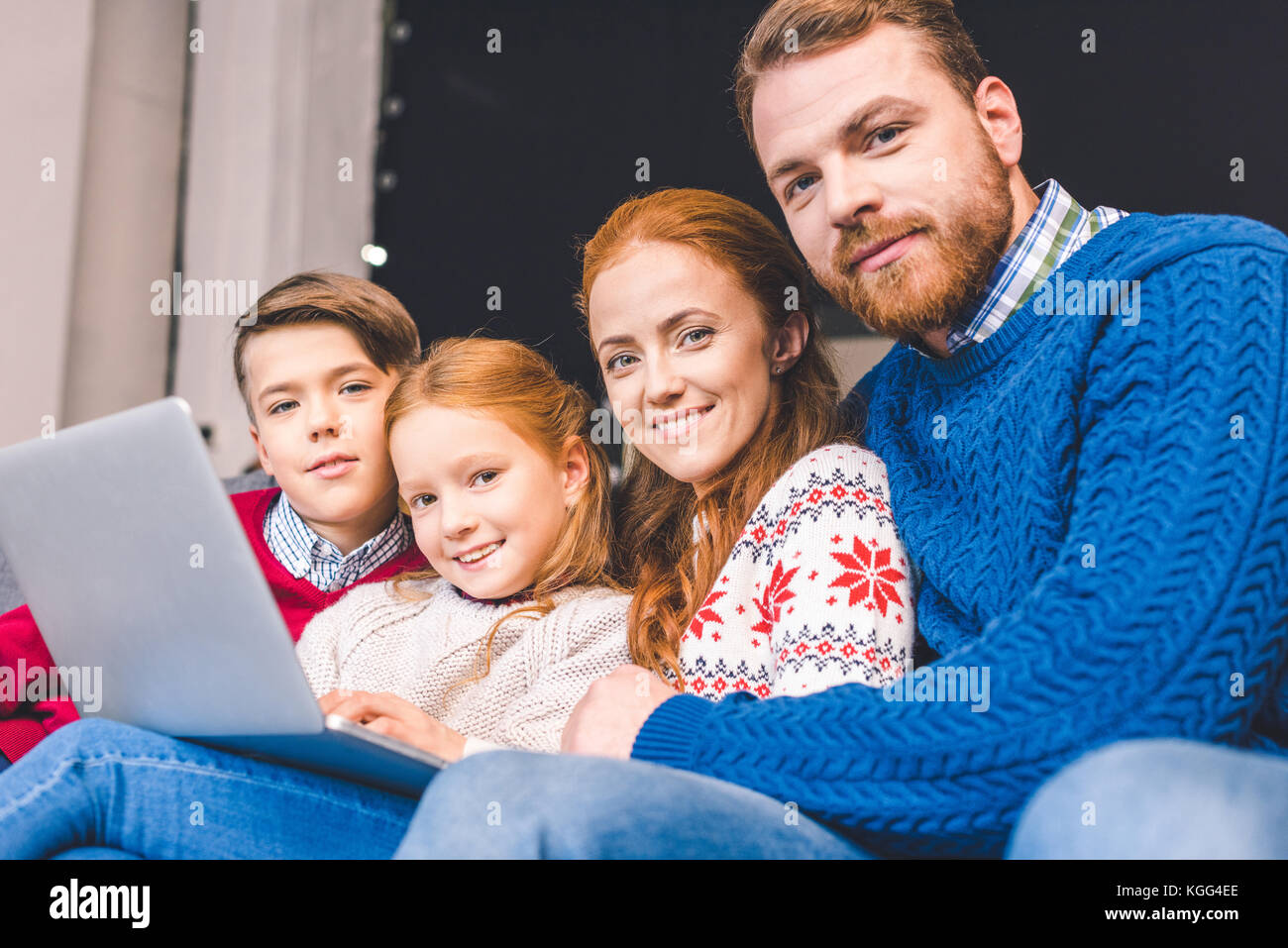 family using laptop together Stock Photo - Alamy