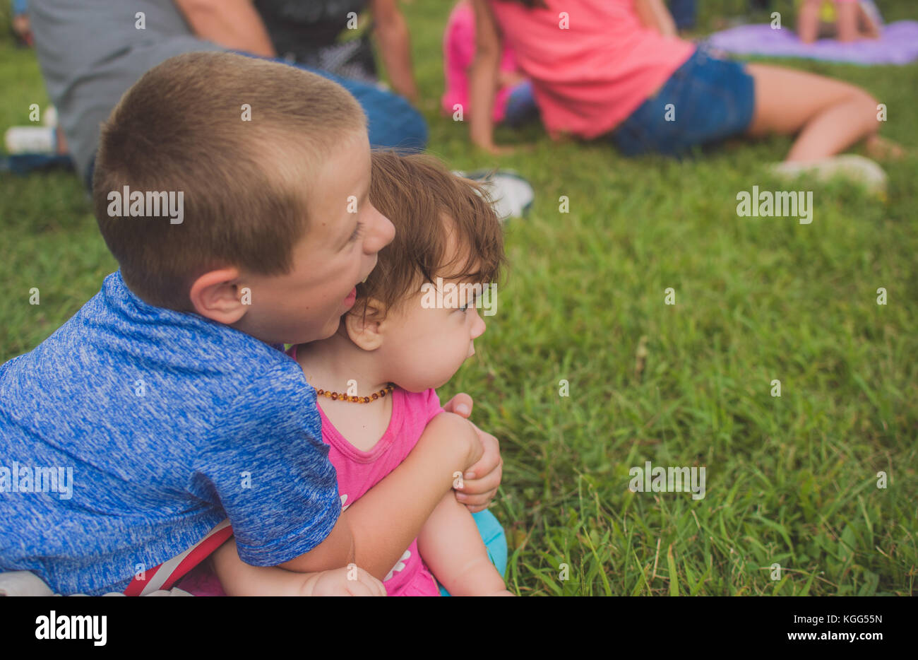 A brother hugs his younger sister on a summer day Stock Photo - Alamy