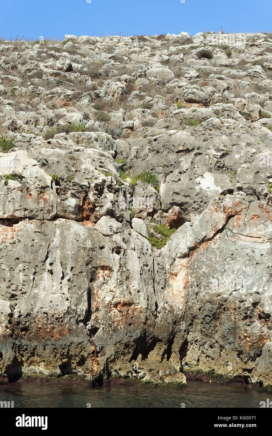 Cliff in Malta. Inlet near Blue Grotto Stock Photo - Alamy