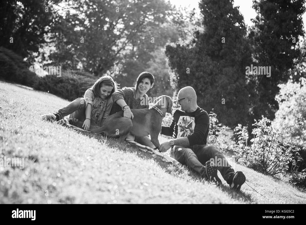 Black and white image of Beautiful gorgeous family of three play Stock ...