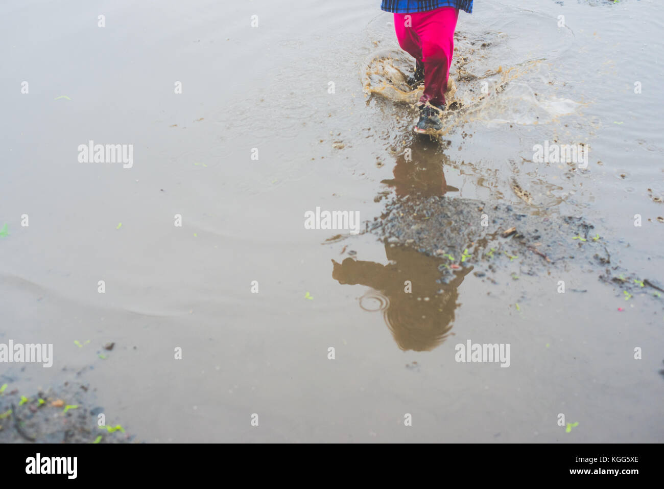 Child puddle reflection hi-res stock photography and images - Alamy