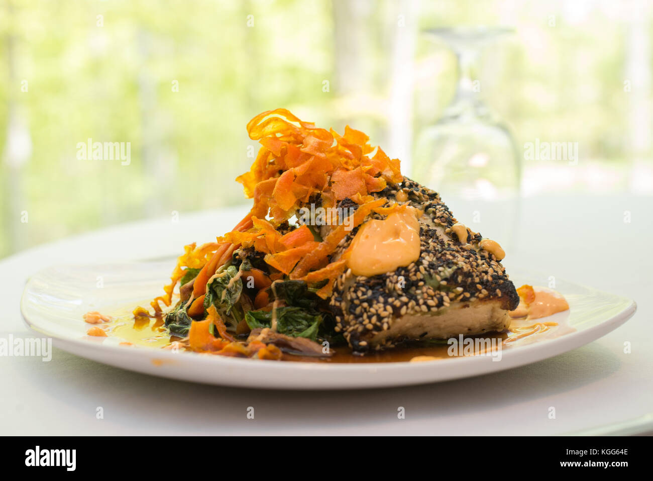 Encrusted fish presented on a plate for a restaurant Stock Photo - Alamy