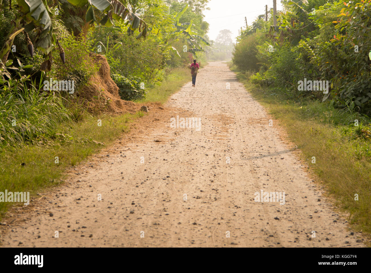 Lady on Village Path Stock Photo - Alamy