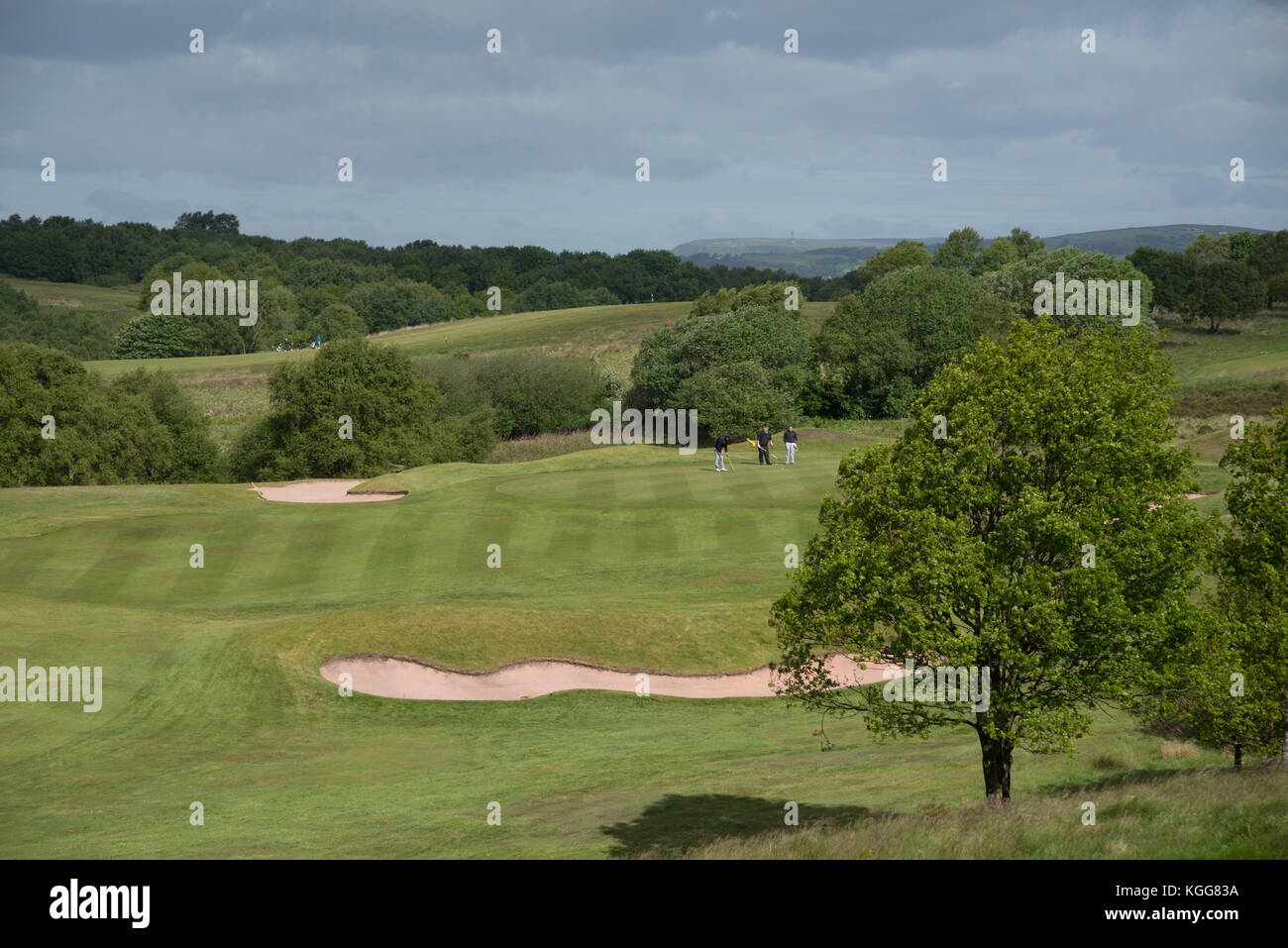 Players playing the first green at Manchester Golf Club, England, UK ...