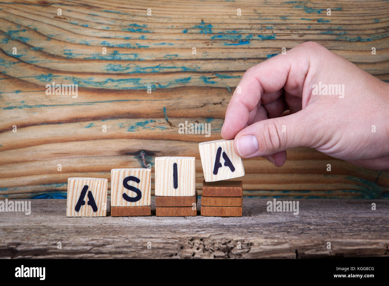 asia. Wooden letters on the office desk, informative and communication ...