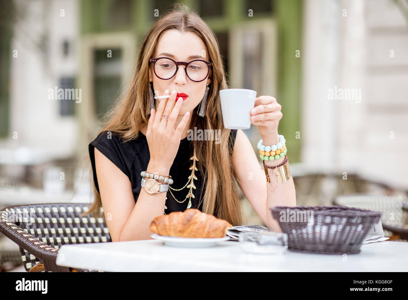 Smoking woman at the french cafe Stock Photo - Alamy
