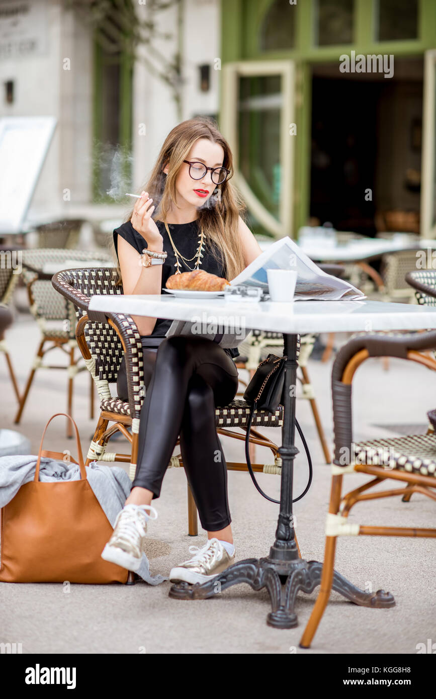 Smoking woman at the french cafe Stock Photo - Alamy