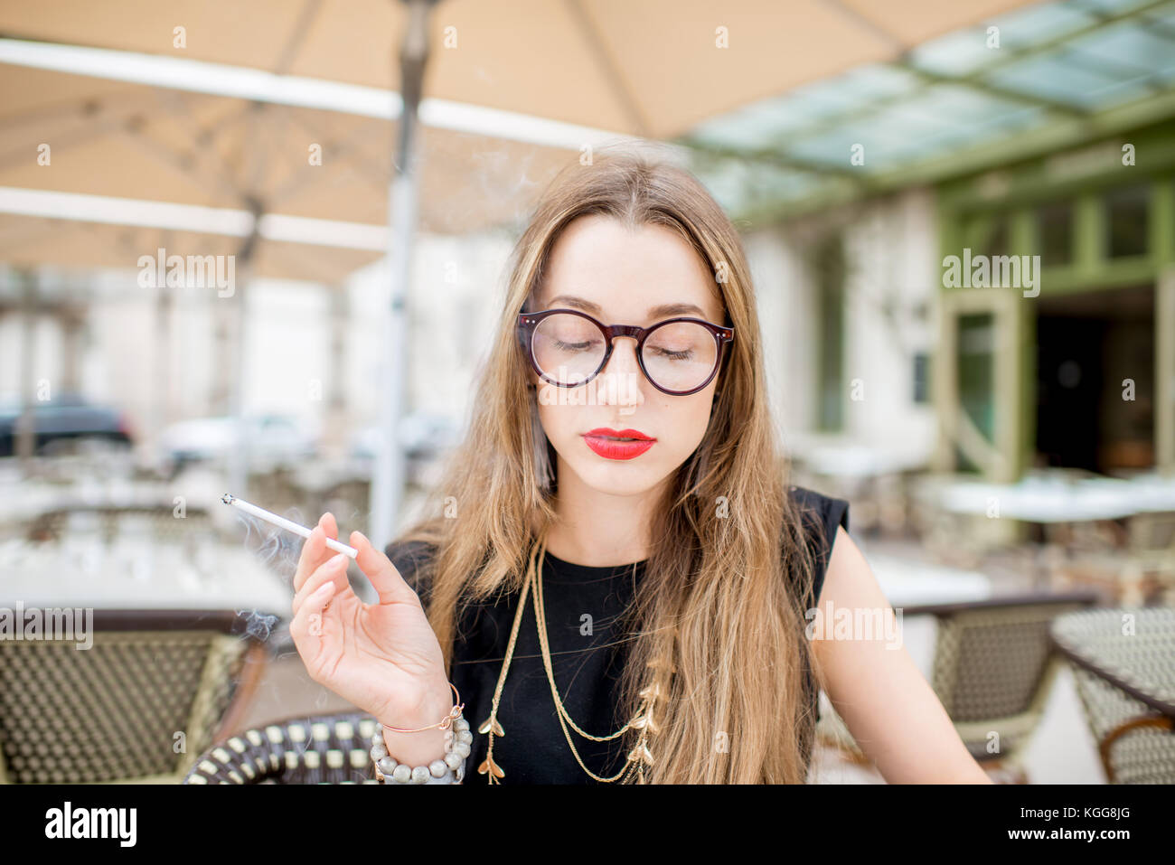 Smoking woman at the french cafe Stock Photo - Alamy
