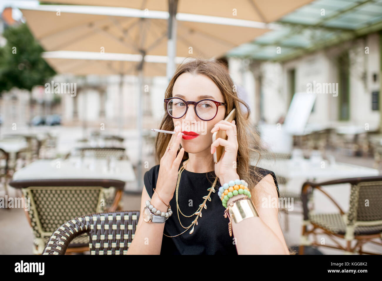Smoking woman at the french cafe Stock Photo - Alamy