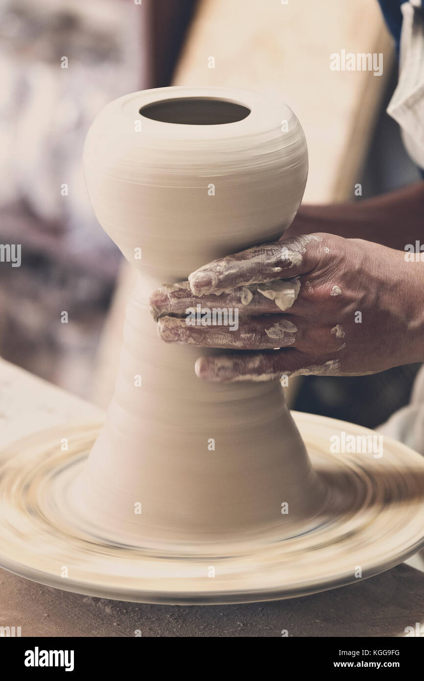 Potter makes pottery handmade in the workshop Stock Photo - Alamy